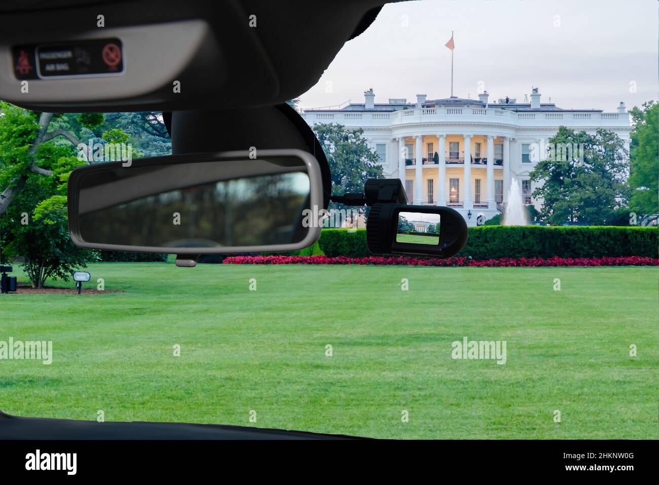 Looking through a dashcam car camera installed on a windshield with ...