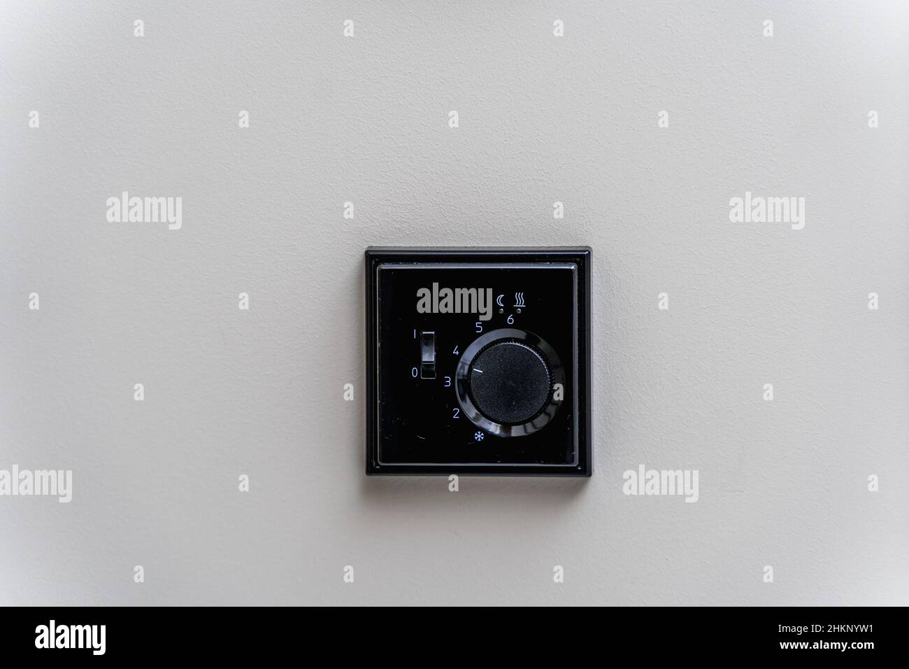 Stylish black light switches on the wall in a newly renovated room ...