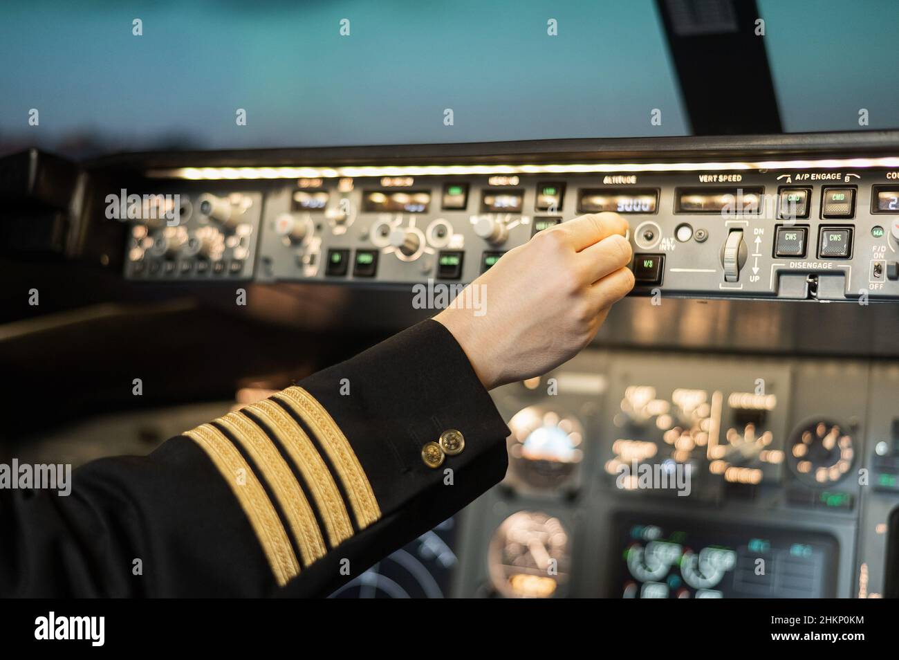 Close-up of a pilot's hand on an airplane control panel Stock Photo - Alamy