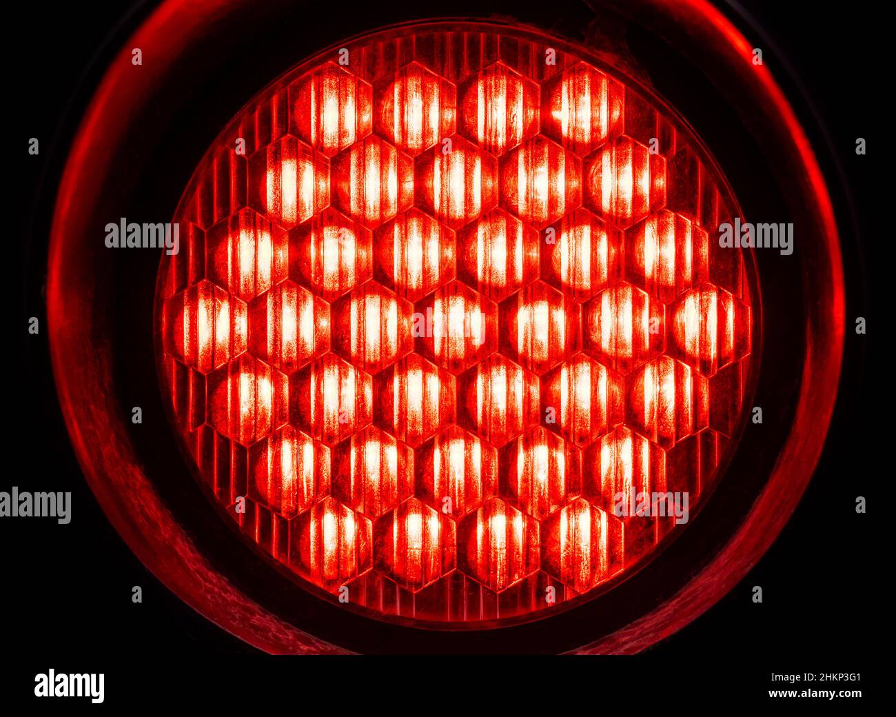 Bright round red light in the dark, object macro, detail, closeup ...