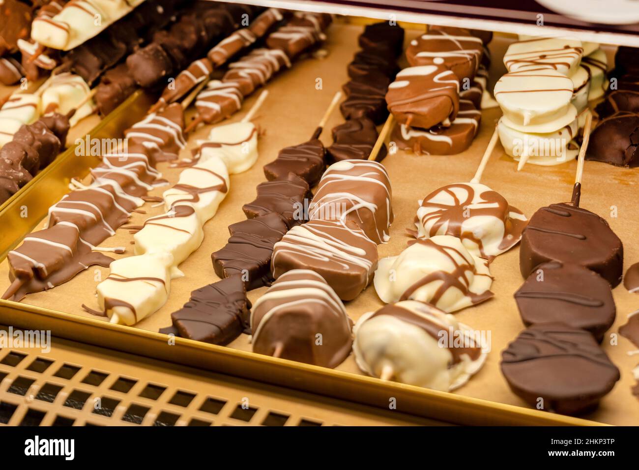 Various different fruits on a stick dipped in chocolate classic ...
