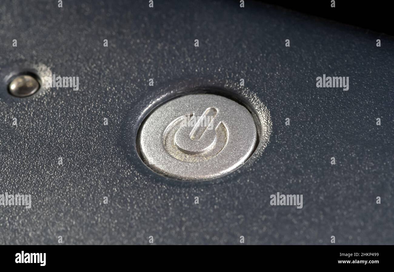 Power button on a laptop computer, powering on a simple electrical ...