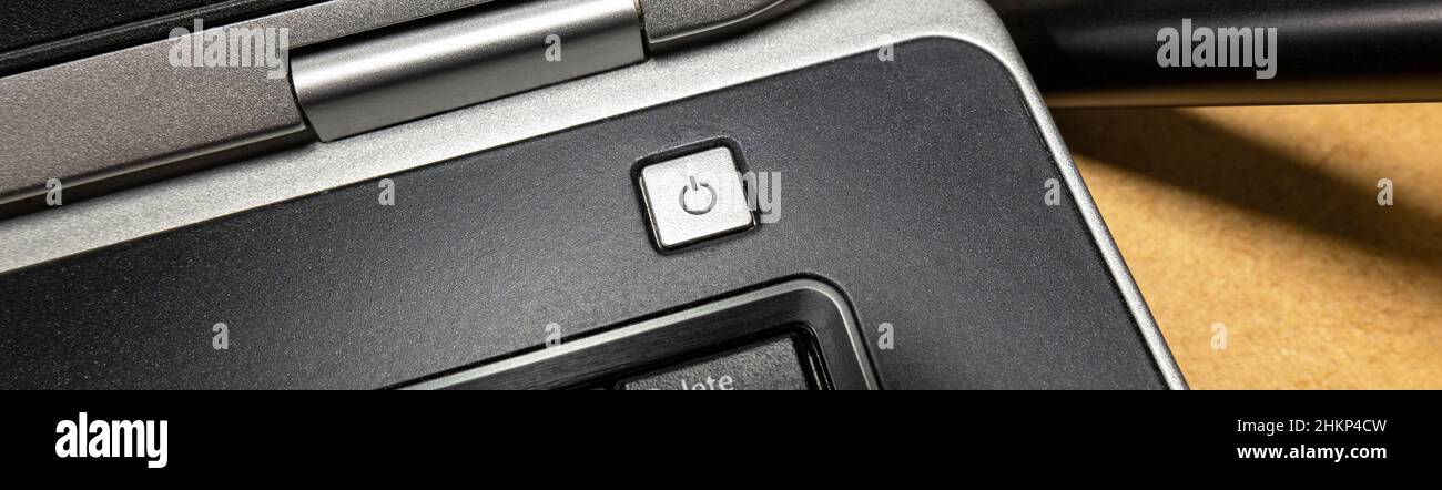 Laptop computer simple silver power button, switch, object detail ...