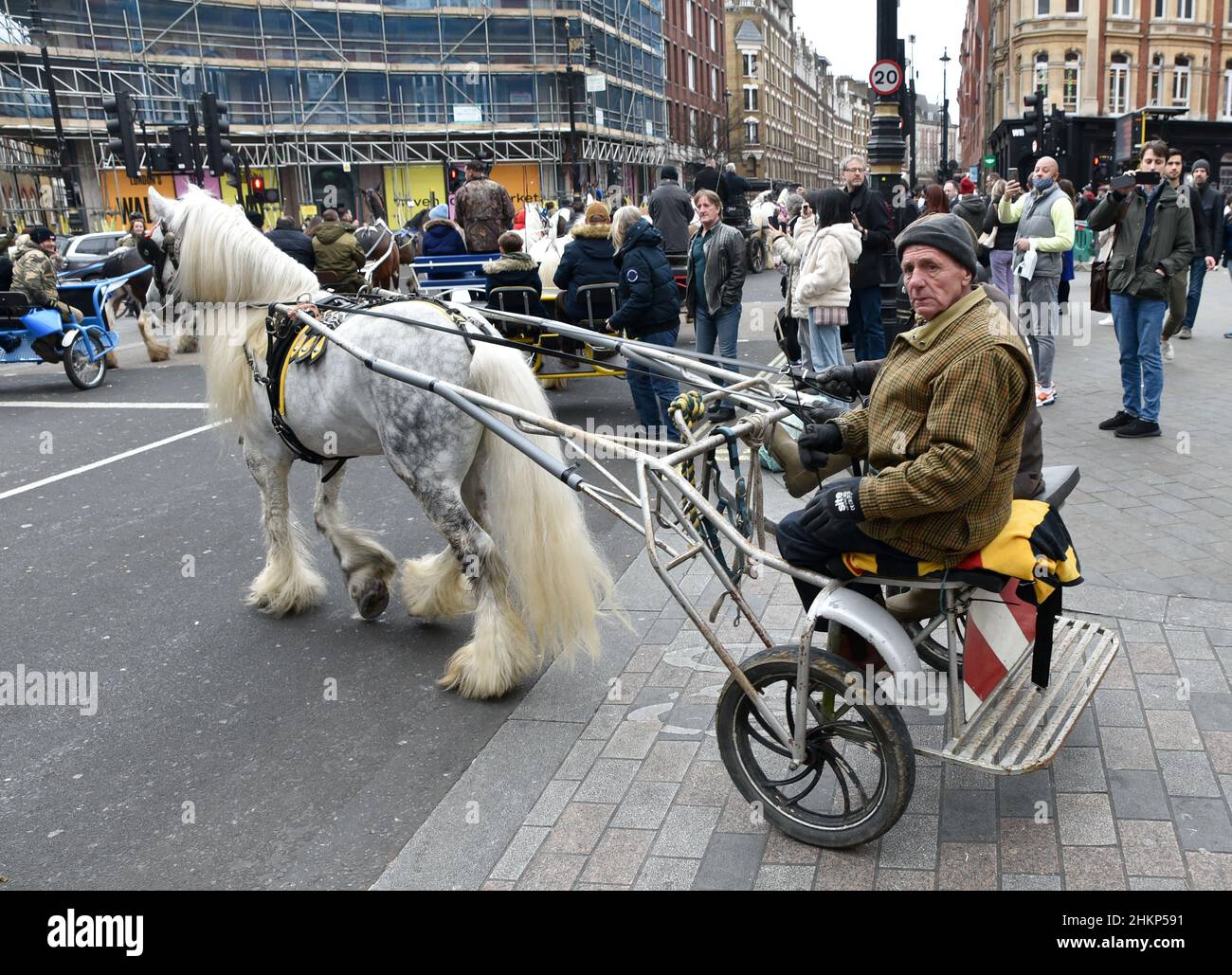 Cambridge Circus, London, UK. 5th February 2022. Travellers and their ...