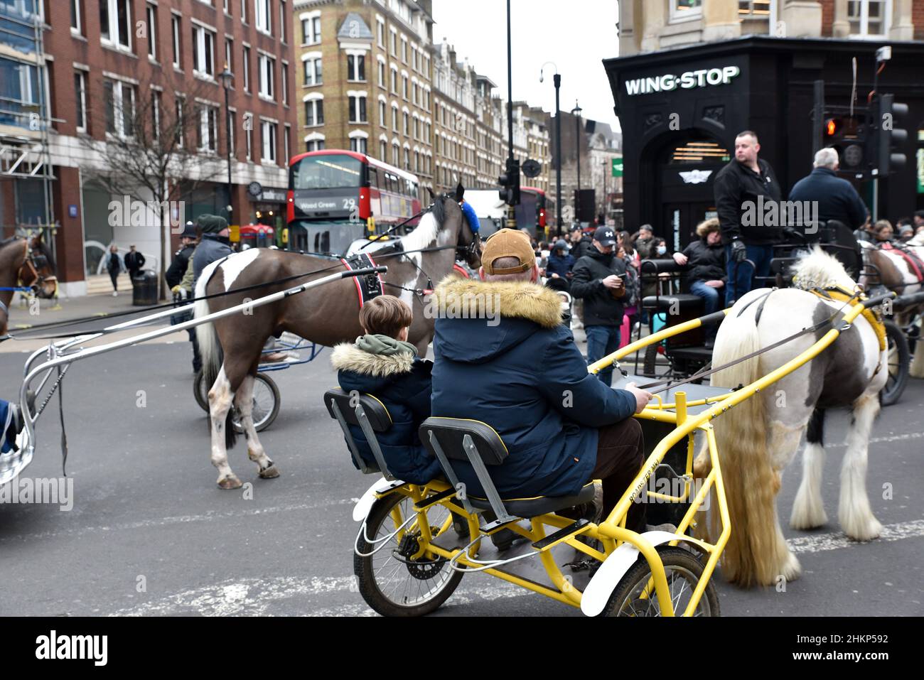 Cambridge Circus, London, UK. 5th February 2022. Travellers and their ...
