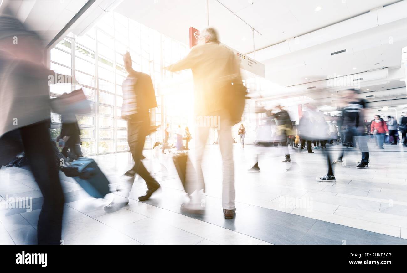 Blurred business people at a trade fair Stock Photo - Alamy