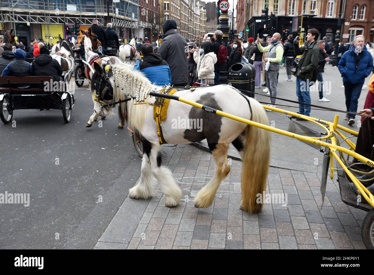 Cambridge Circus, London, UK. 5th February 2022. Travellers and their ...
