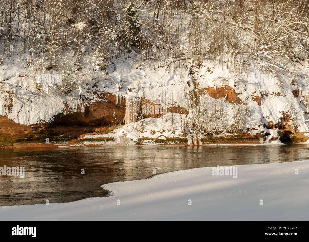 magical sunny winter day, landscape with red sandstone cliffs that are ...