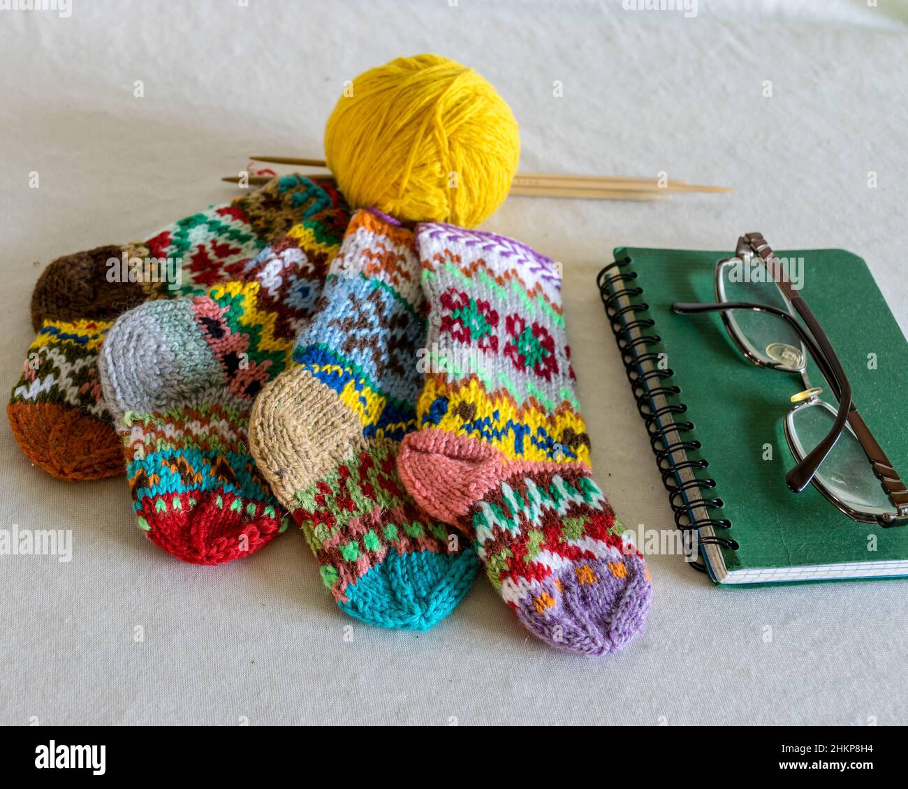 handicraft concept, colorful knitted socks, knitting as a hobby, a good ...