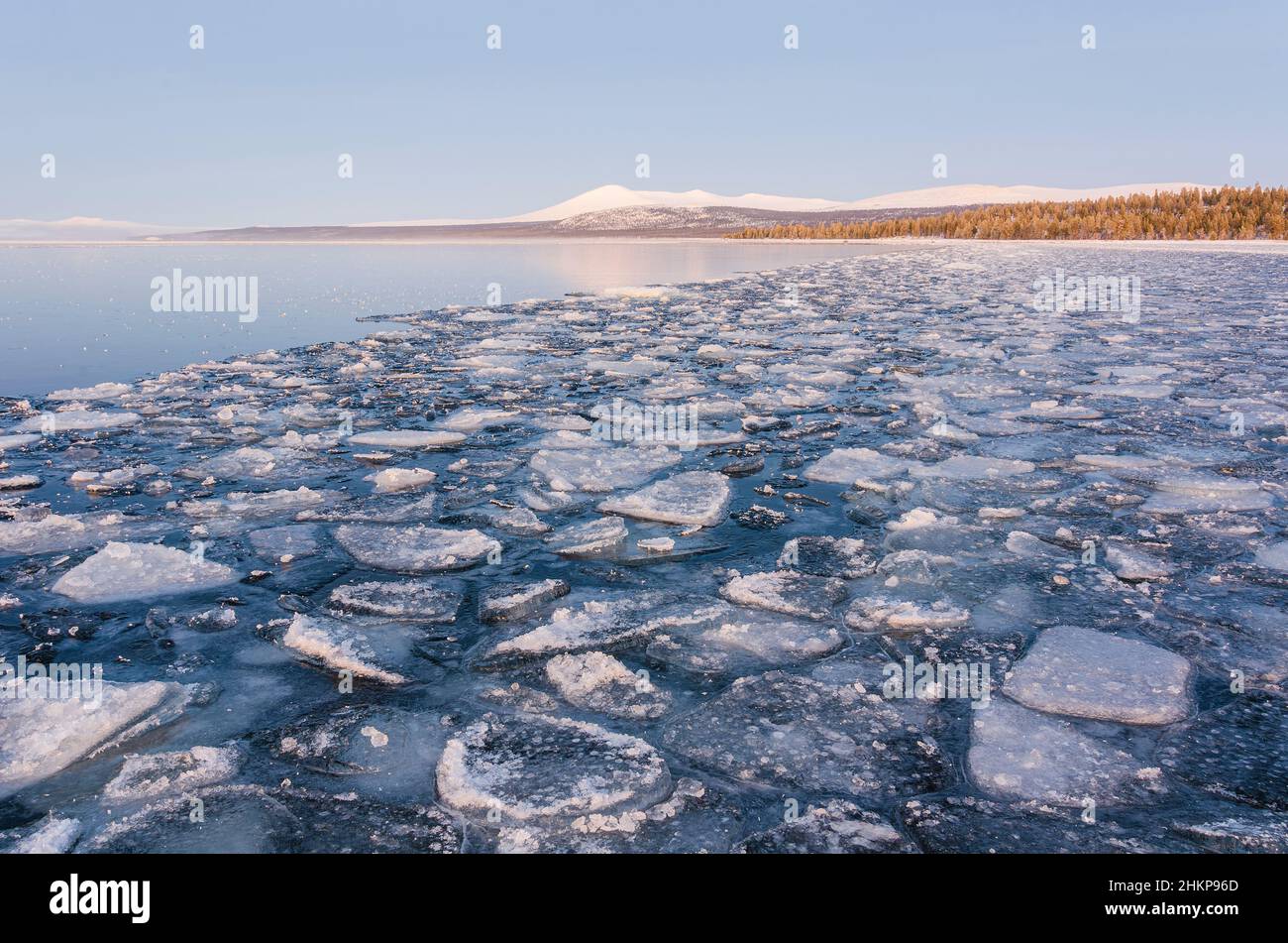 Ice blocks on frozen lake Stock Photo - Alamy