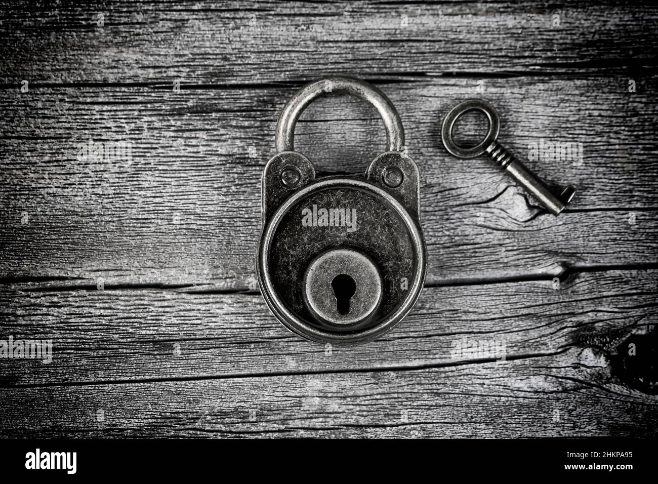 Close up of antique lock and key on aged wooden planks with vintage ...