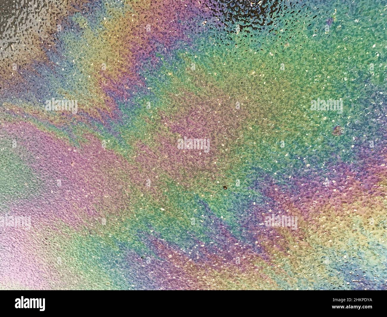 Gasoline that had leaked onto a wet asphalt. Abstract wet colors Stock ...