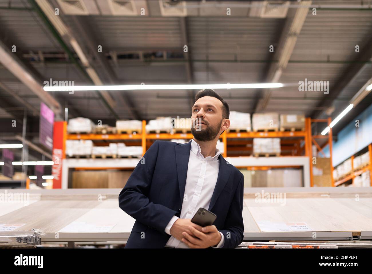 hardware store customer in flooring department Stock Photo - Alamy
