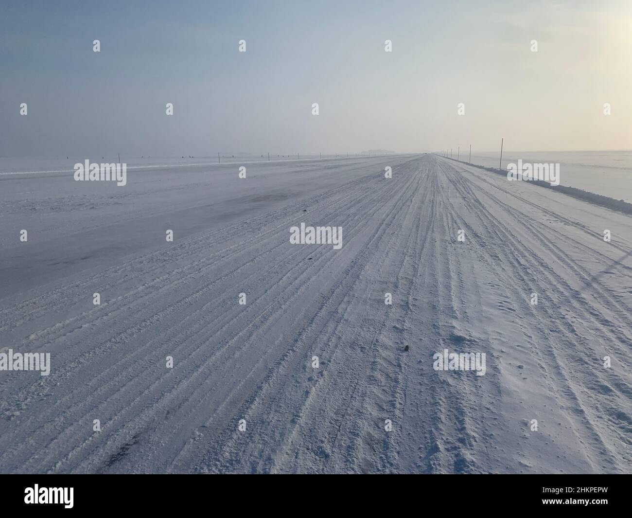 An empty winter road. Road which seems to go nowhere Stock Photo - Alamy