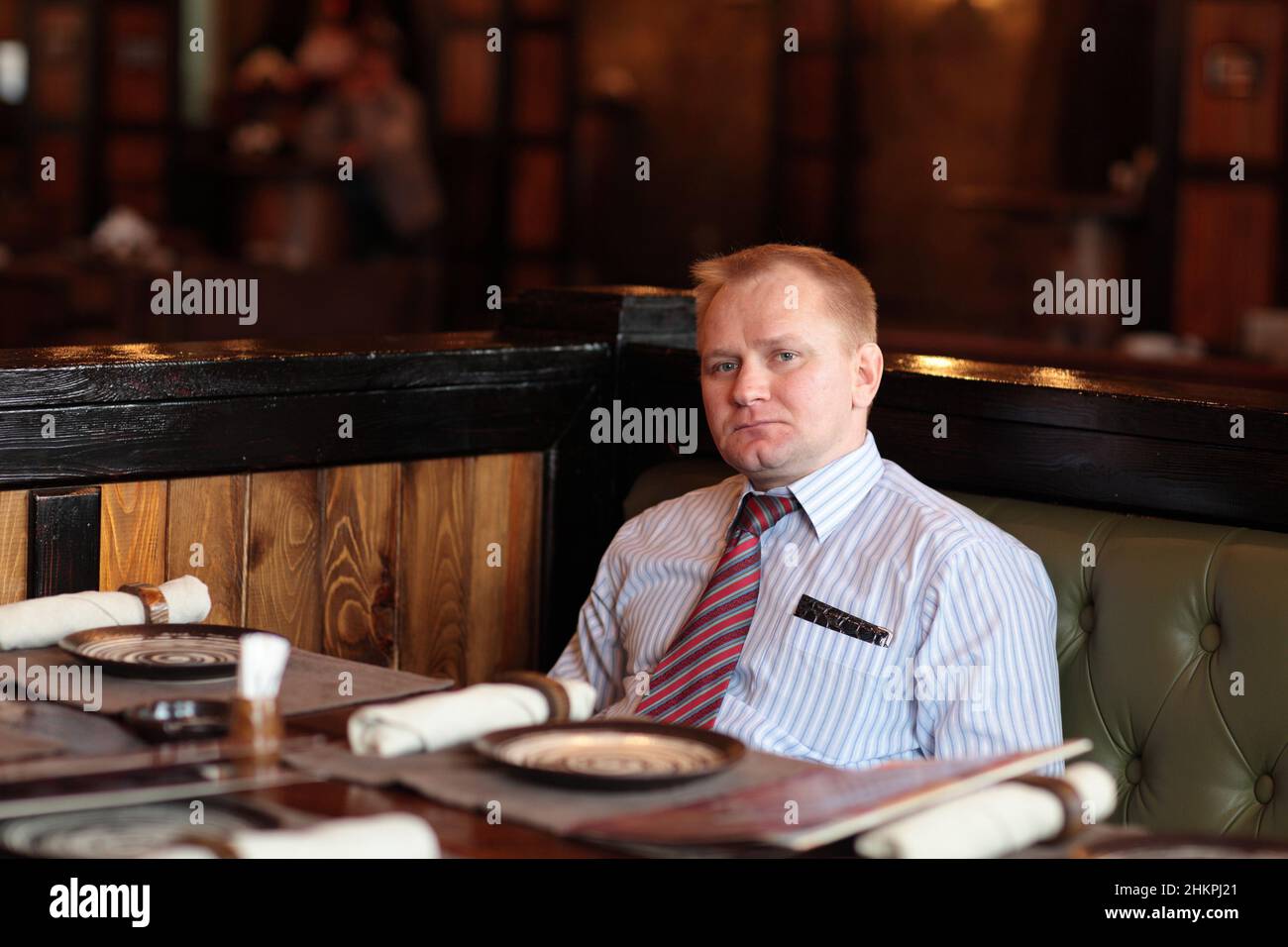 The manager poses at the restaurant in the evening Stock Photo - Alamy