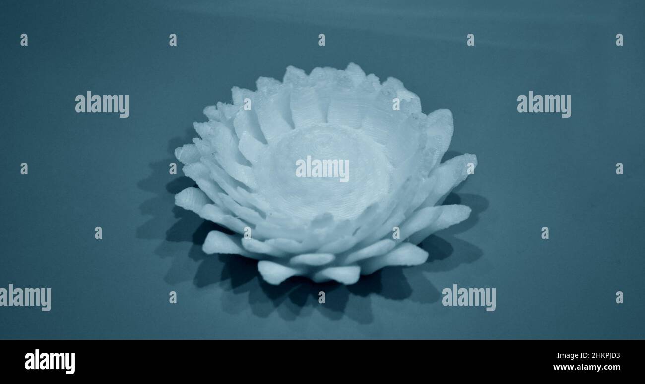 Abstract isolated object flower of a yellow color printed on a 3d ...