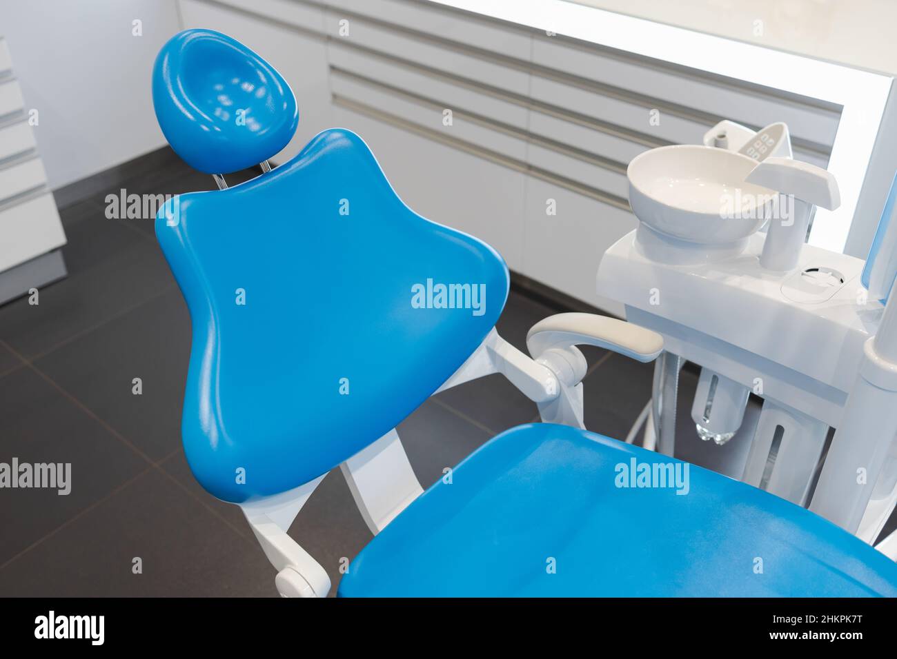 Blue dental chair in the modern dentistry office Stock Photo - Alamy