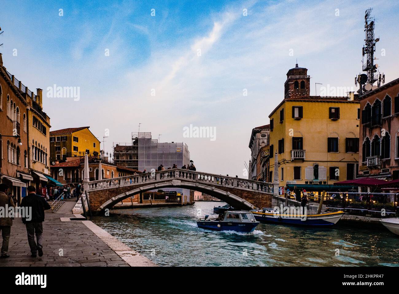 boat going under bridge in Venice canal Stock Photo - Alamy