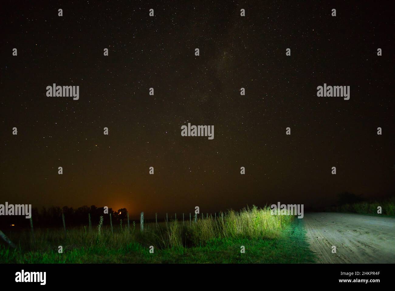 dirt road in the field at night Stock Photo - Alamy