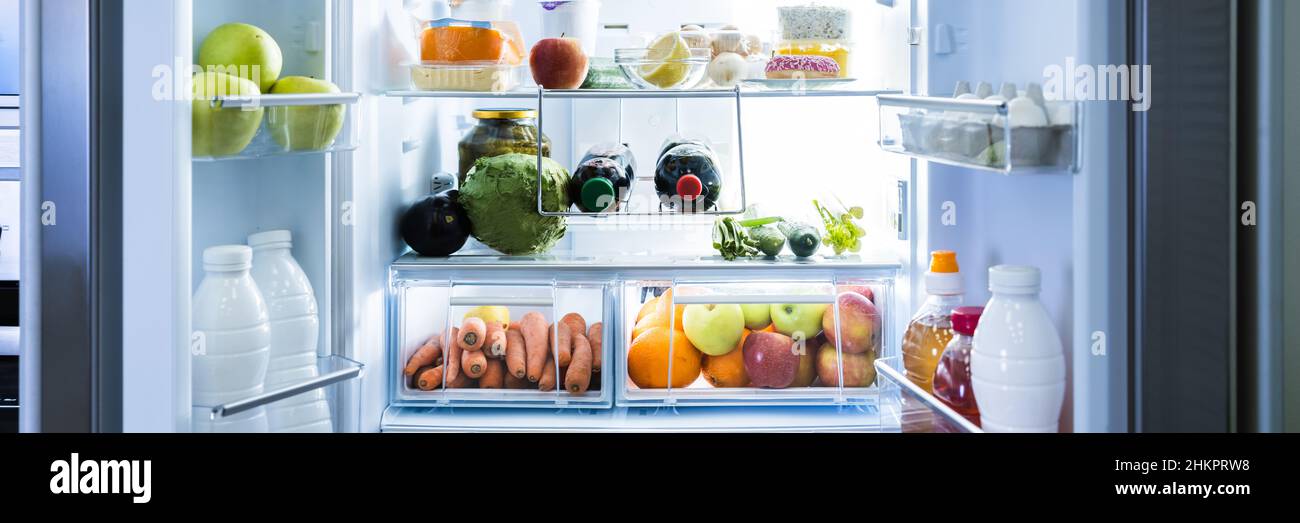 Full Open Refrigerator Or Fridge At Night In Kitchen Stock Photo - Alamy