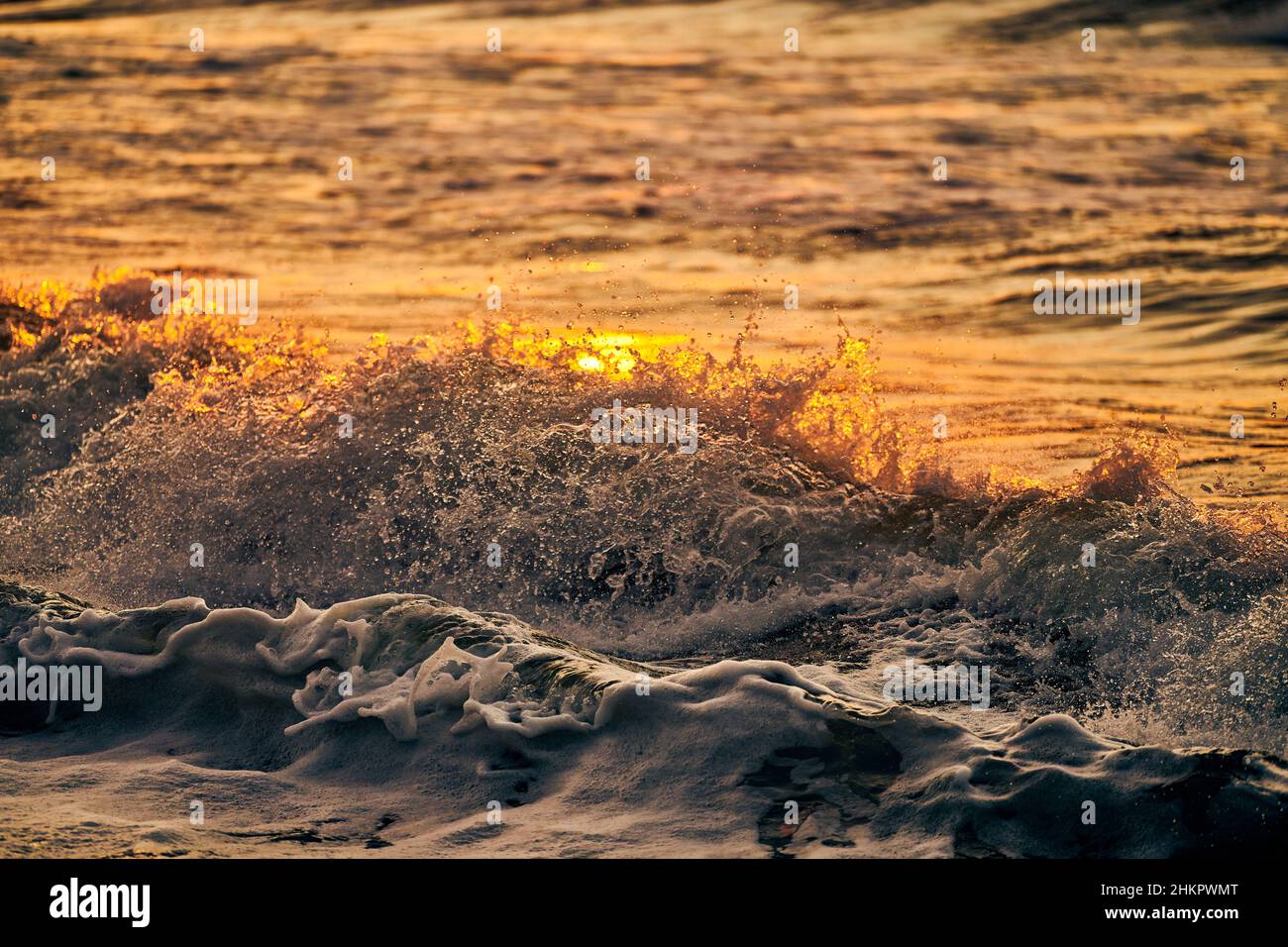 Atmospheric sea foam at colorful sunset, beautiful scene of deep sea ...