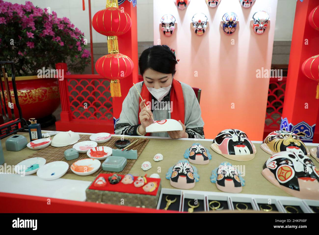 Beijing, China. 5th Feb, 2022. A craftswoman shows the Chinese opera ...