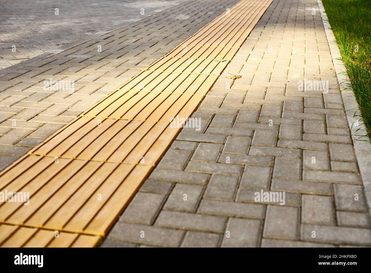 Tactile paving on pedestrian walkway, yellow tactile tiles outdoor ...