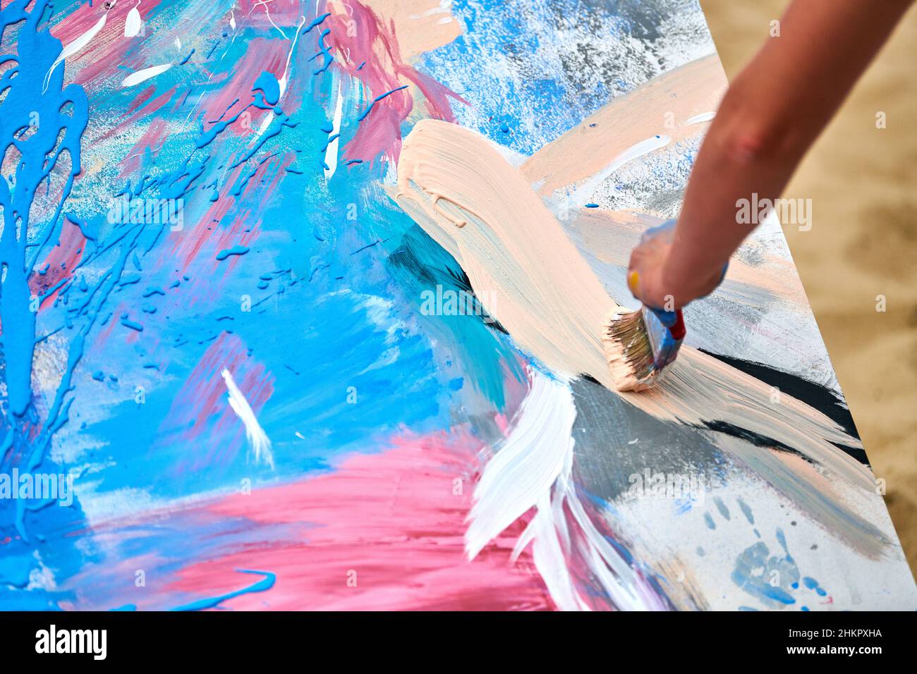 Drip painting expression art on canvas with blue, pink and beige colors ...