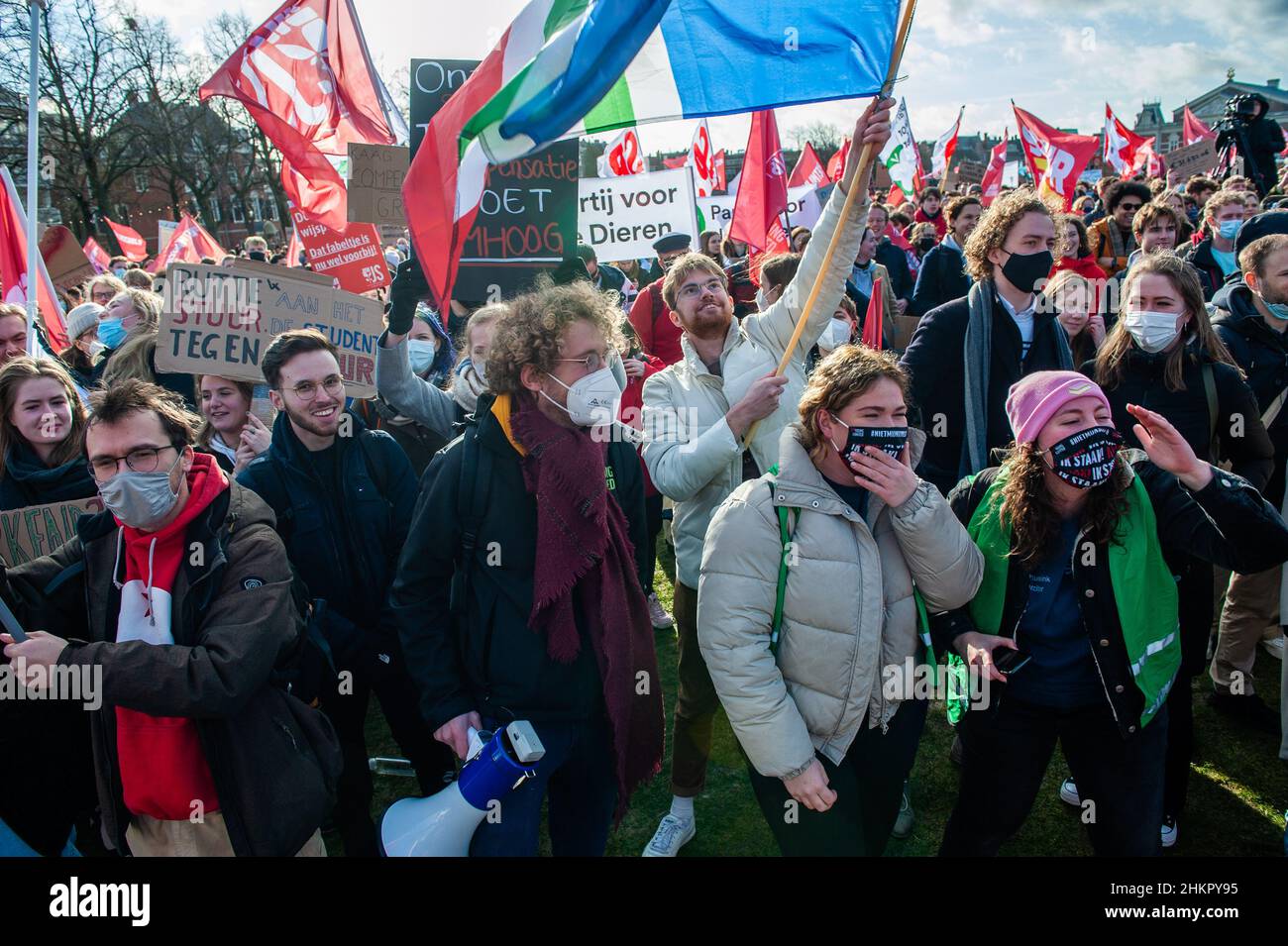 Dutch students are seen holding flags and a placard expressing their ...
