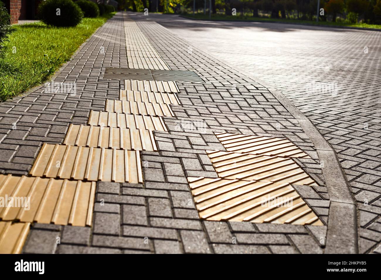 Tactile paving on pedestrian walkway, yellow tactile tiles outdoor ...