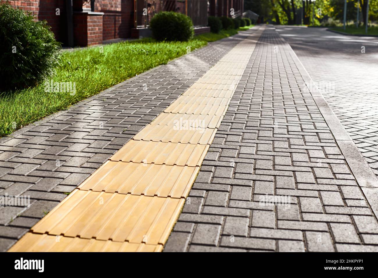Tactile paving on pedestrian walkway, yellow tactile tiles outdoor ...