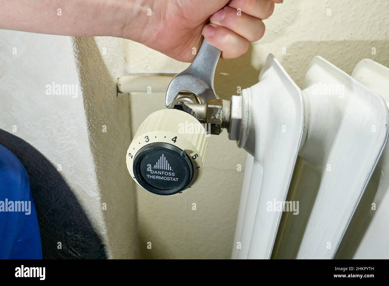 Stuttgart, Germany - February 01, 2022: Hand replace old danfoss ...