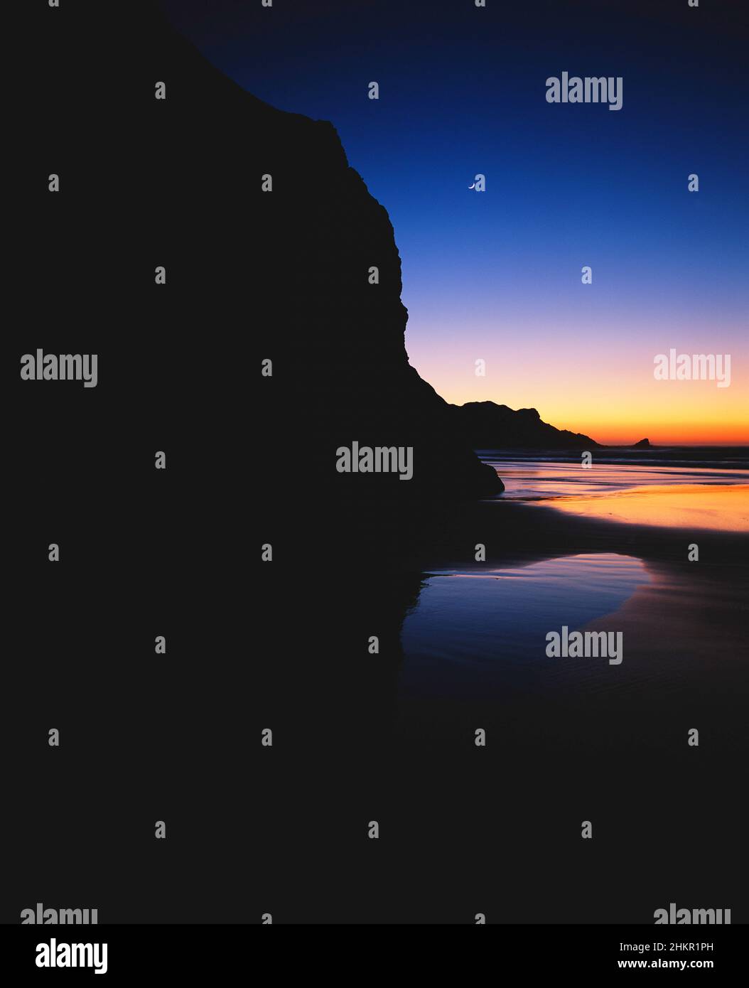Sunset with crescent moon at Cape Sebastian scenic area along southern ...