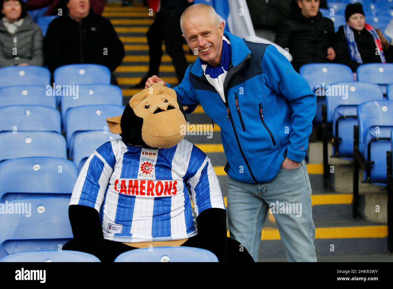 A Hartlepool United fan poses with Angus the Monkey Stock Photo - Alamy