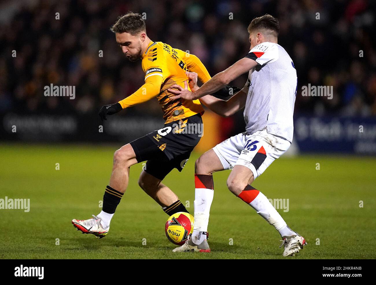 Cambridge United's Sam Smith (left) and Luton Town's Reece Burke battle ...