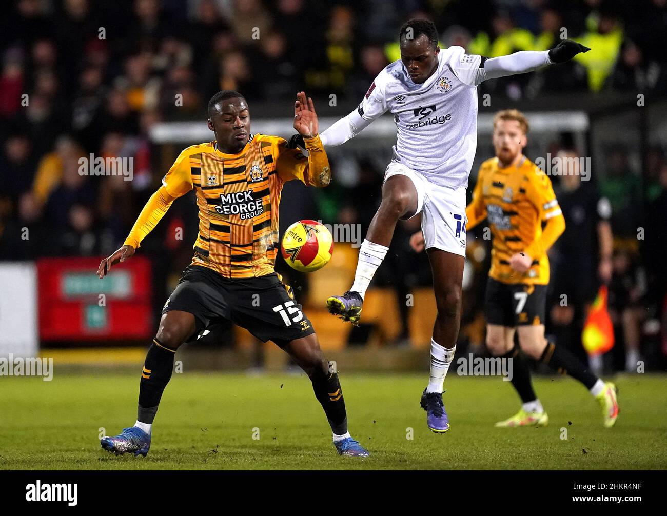 Cambridge United's Jubril Okedina (left) and Luton Town's Carlos Mendes ...