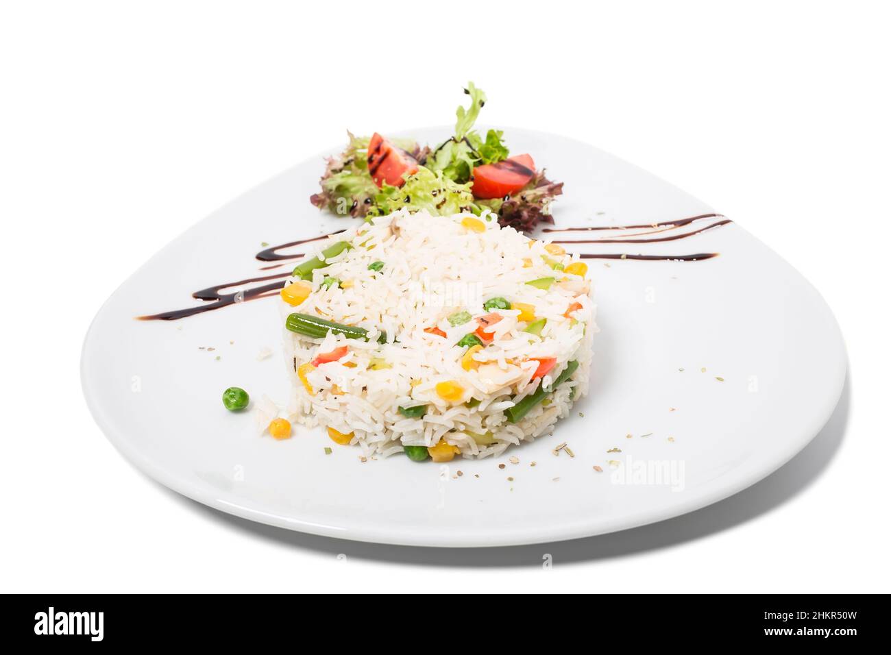 Long white rice with sauce and vegetables. Isolated on a white ...