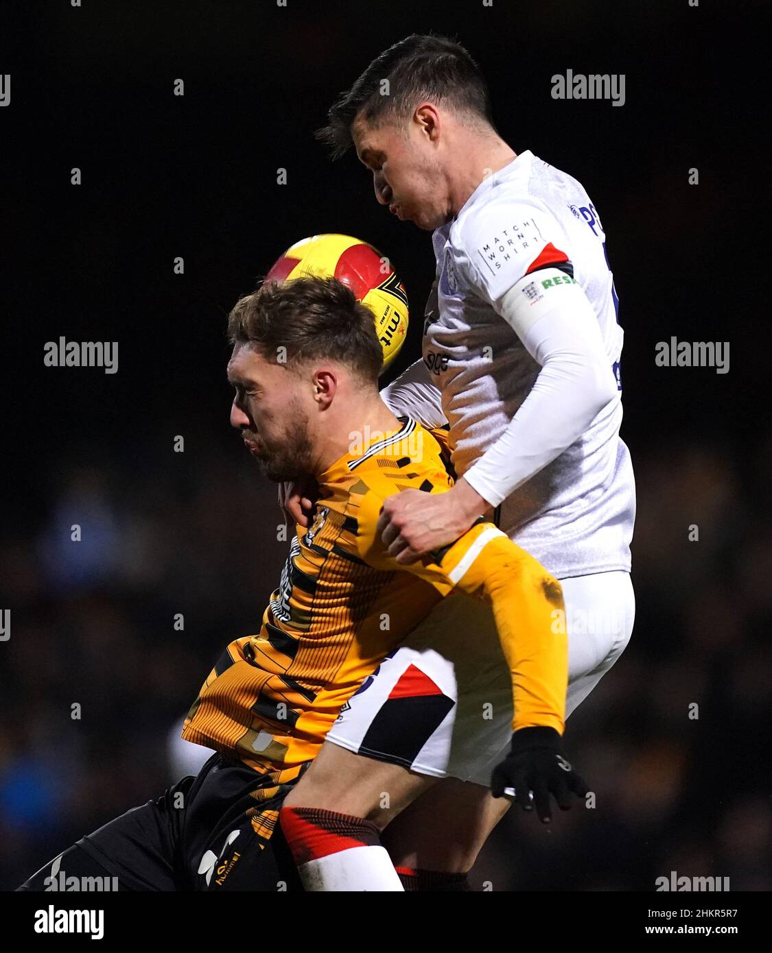 Cambridge United's Sam Smith (left) and Luton Town's Dan Potts battle ...