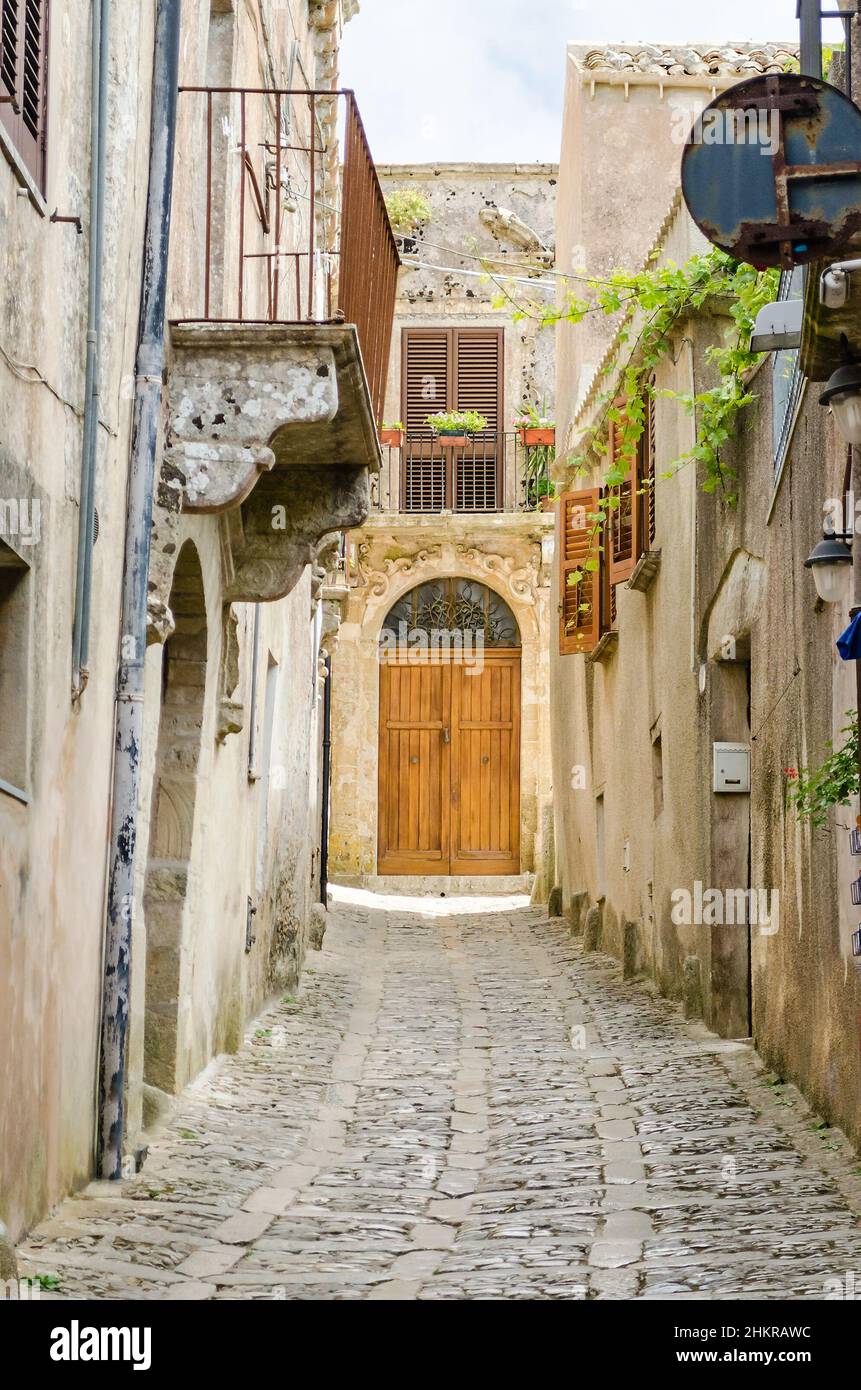 Stone paved ancient medieval street in the town of Erice, Sicily, Italy ...