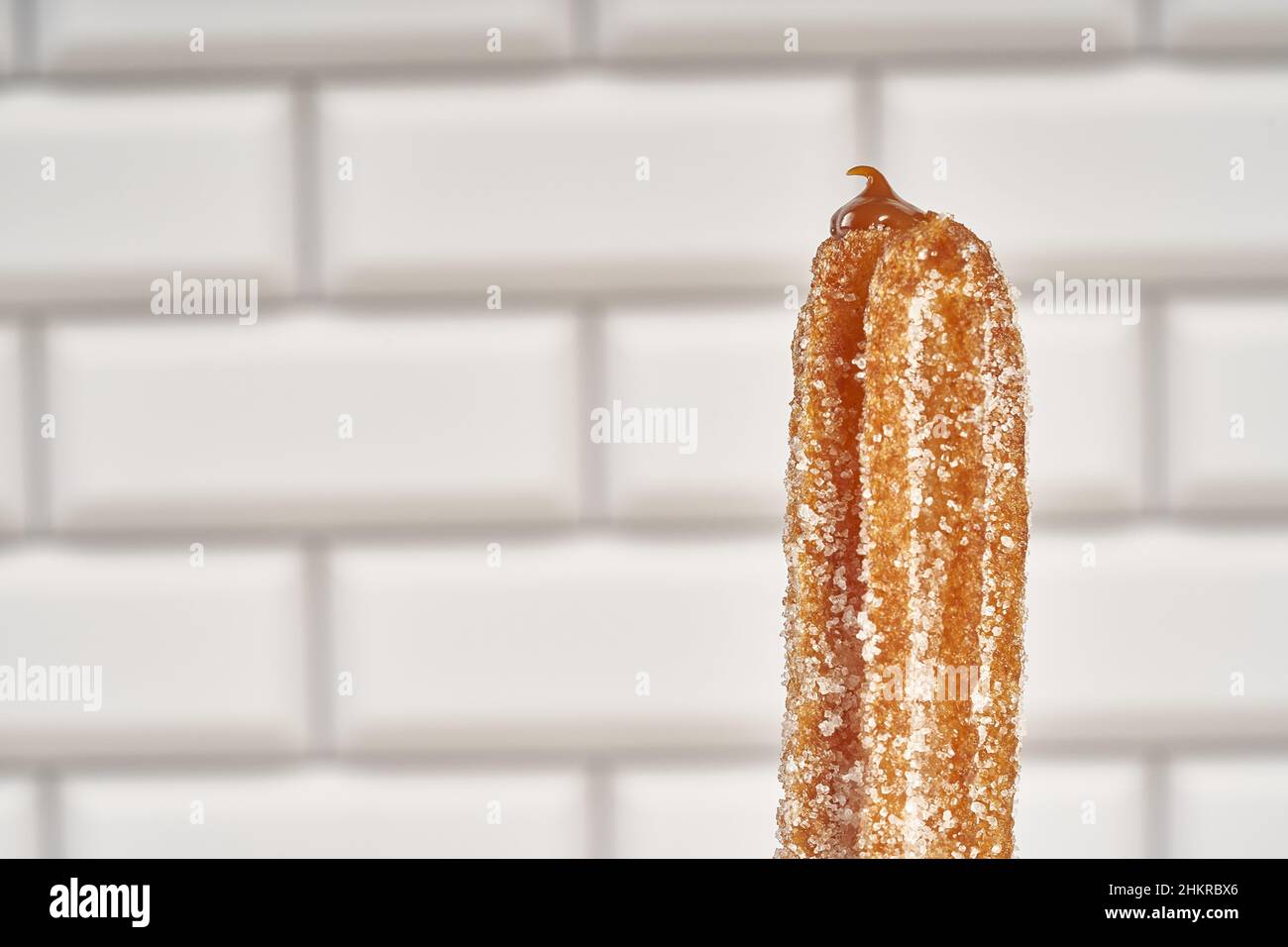 Shot of a churro on a white ceramic background with copy space Stock ...