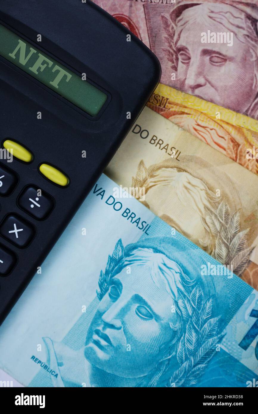 NFT written in calculator with brazilian money background Stock Photo ...