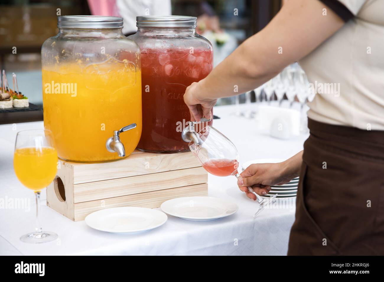 Two holding containers hi-res stock photography and images - Alamy