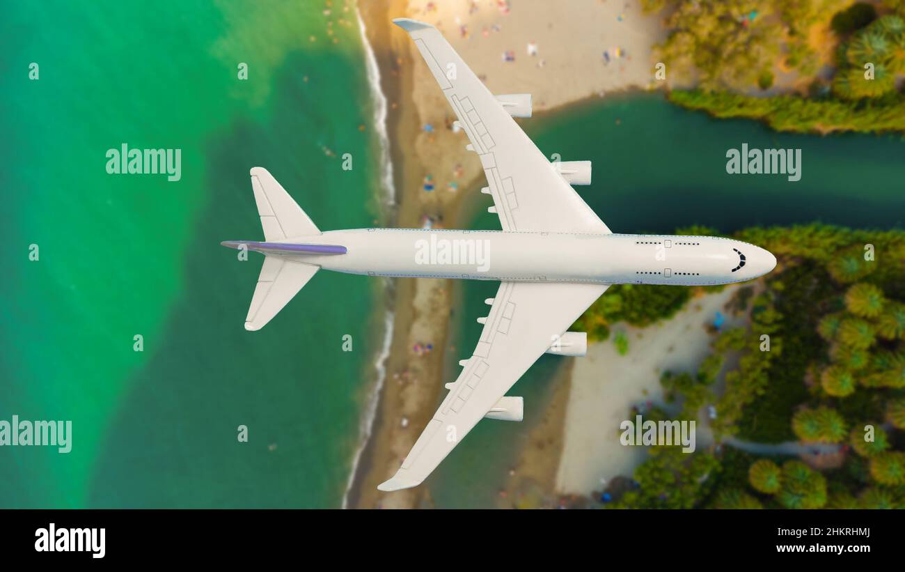 Aerial top down view of an airplane flying over blue sea as a travel ...