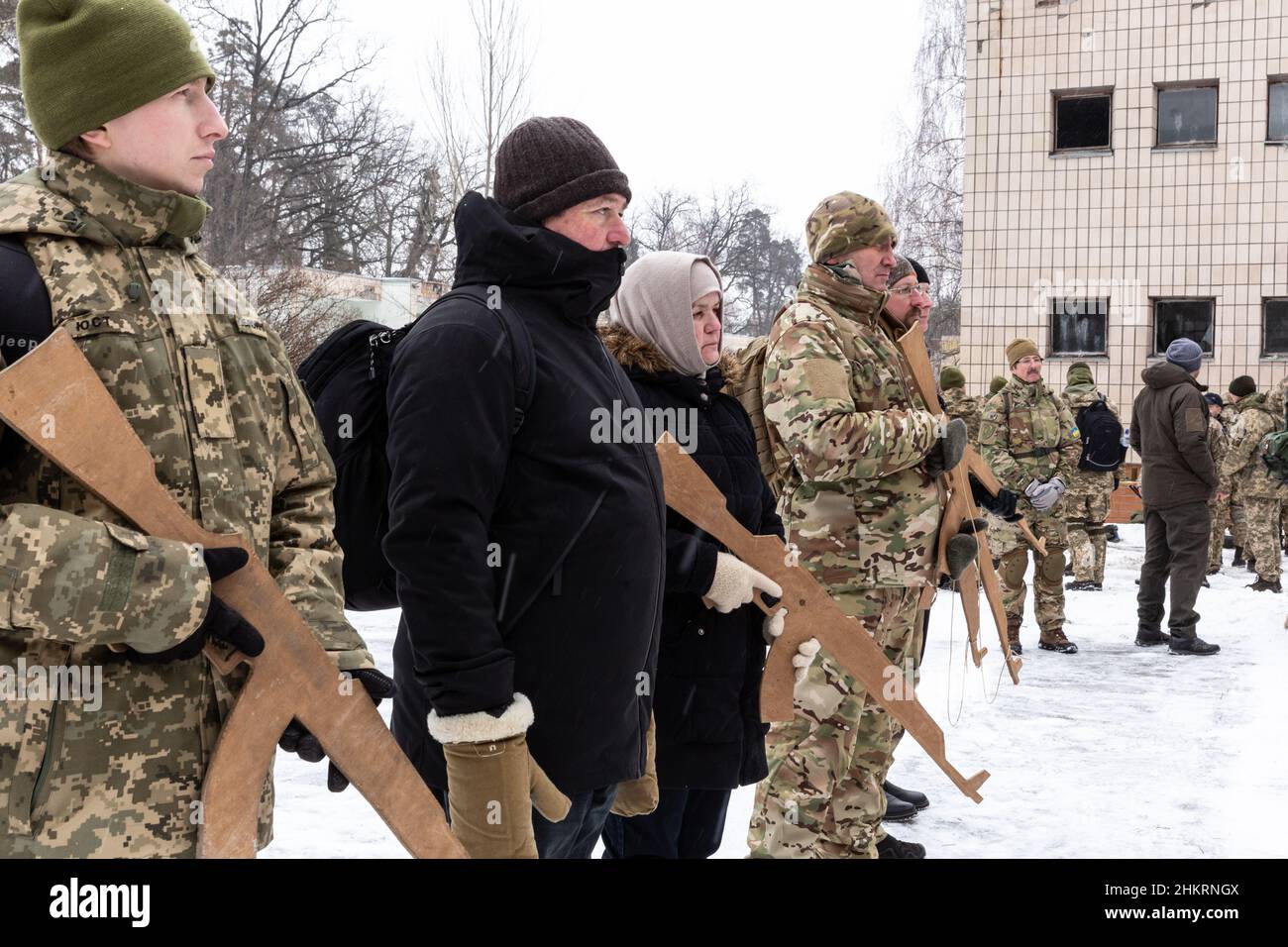 Civilians hold fake rifles during Territorial Defence Force exercise ...