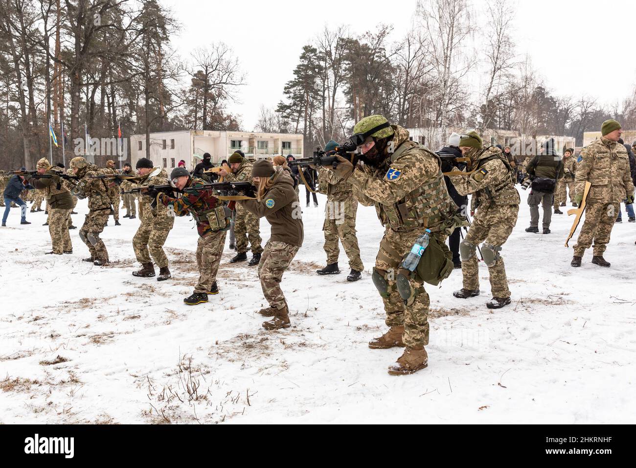 Civilians hold rifles during Territorial Defence Force exercise while ...