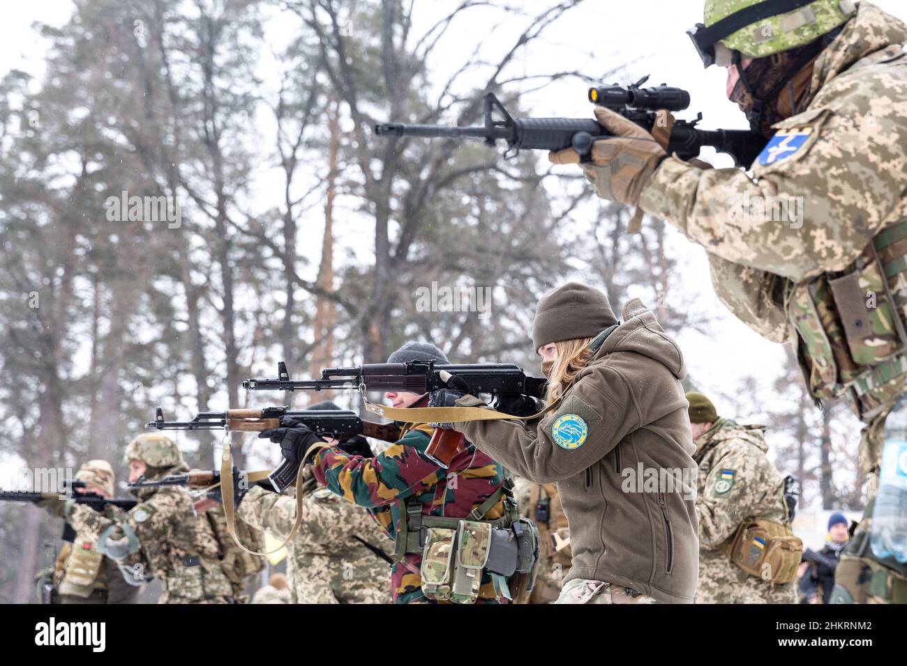 Civilians hold rifles during Territorial Defence Force exercise while ...