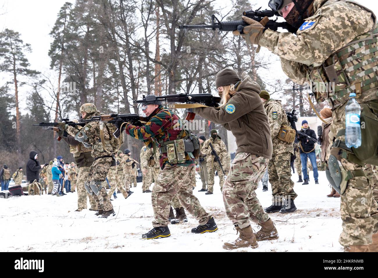Civilians hold rifles during Territorial Defence Force exercise while ...