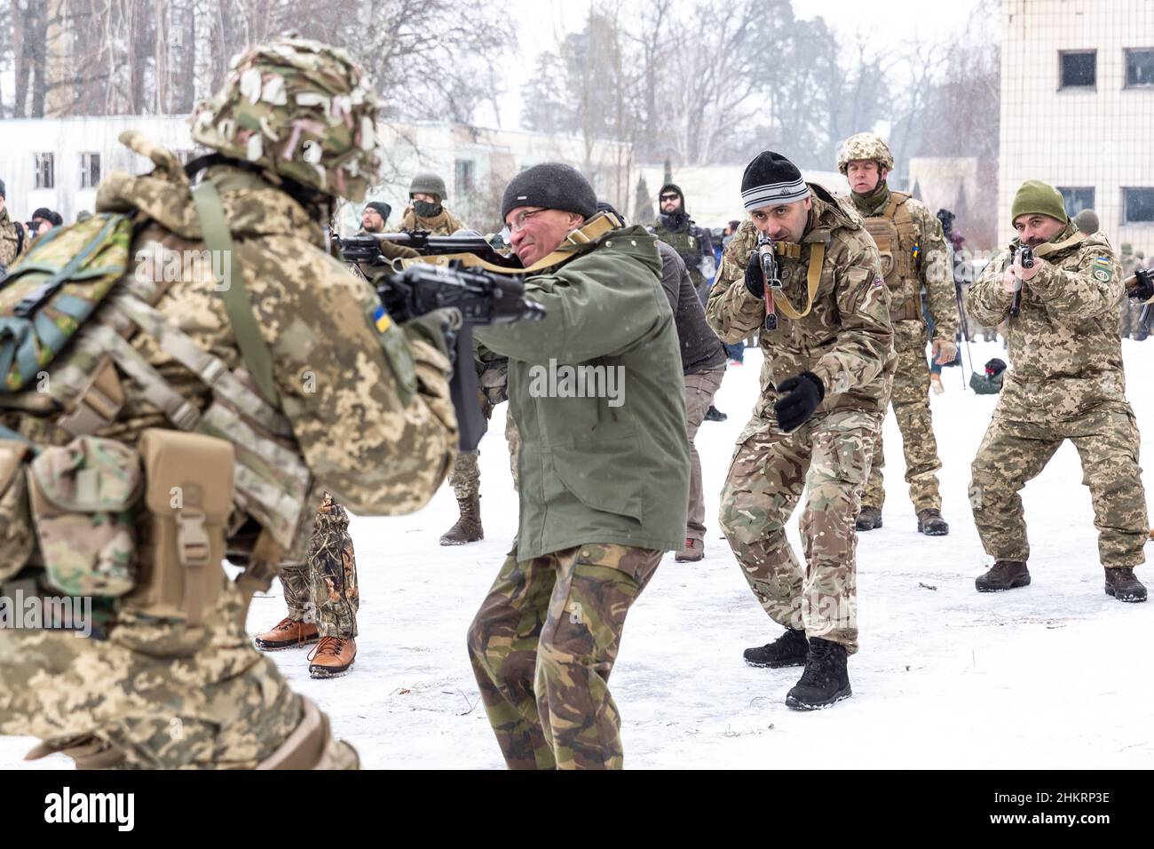 Civilians hold rifles during Territorial Defence Force exercise while ...