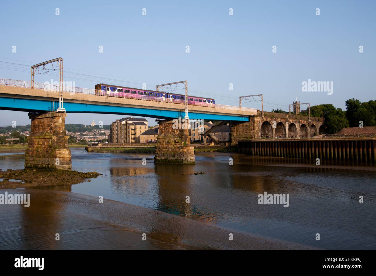 A Northern Rail class 156 sprinter train crosses Carlisle bridge, at ...