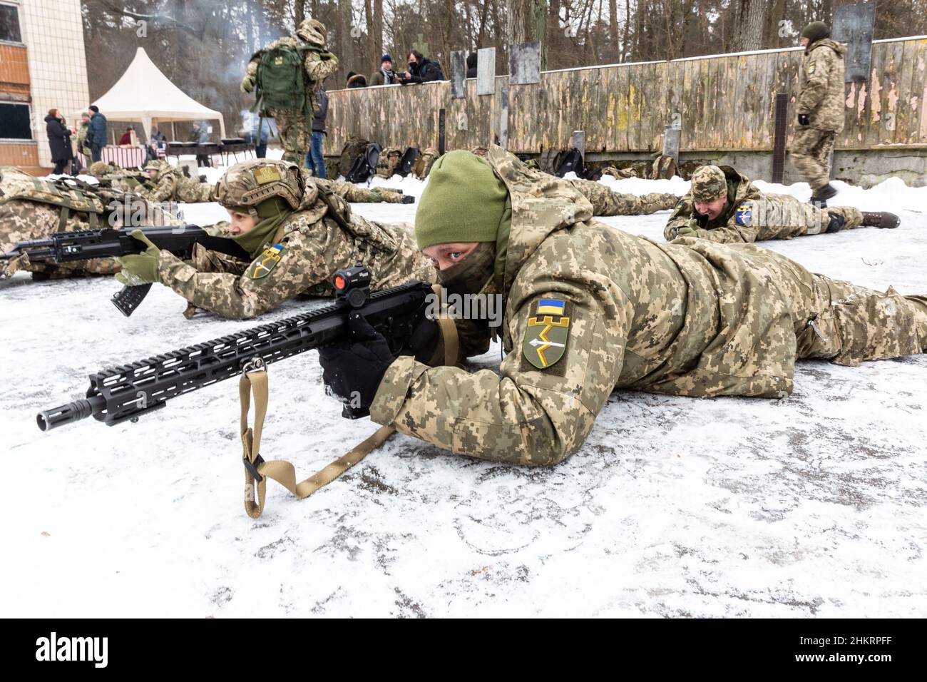Civilians hold rifles during Territorial Defence Force exercise while ...
